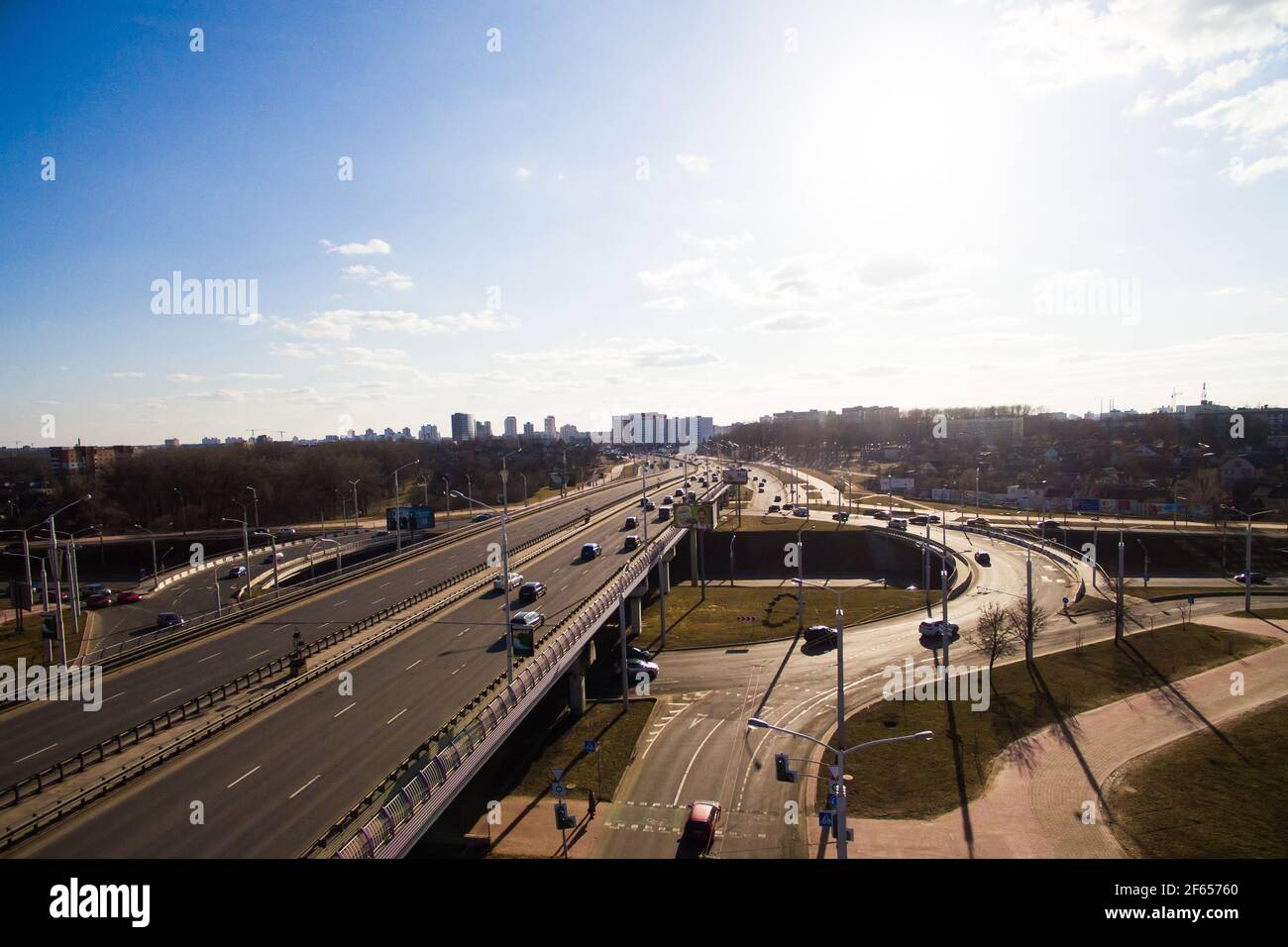 Aerial view at junctions of city highway. Vehicles drive on roads ...