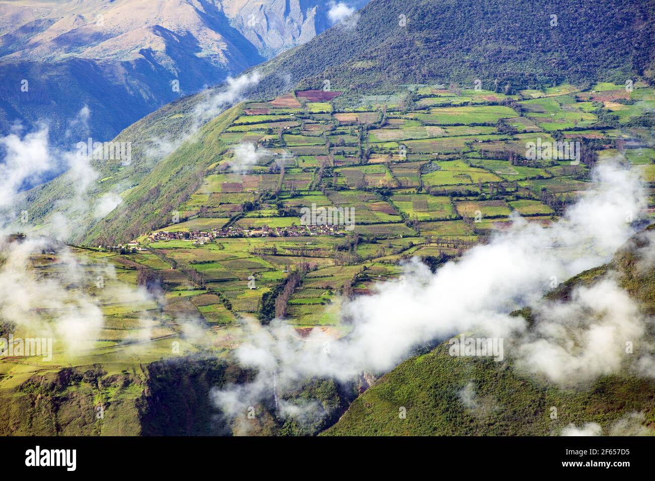 Village and terraced field in the middle of clouds in peru, view from ...