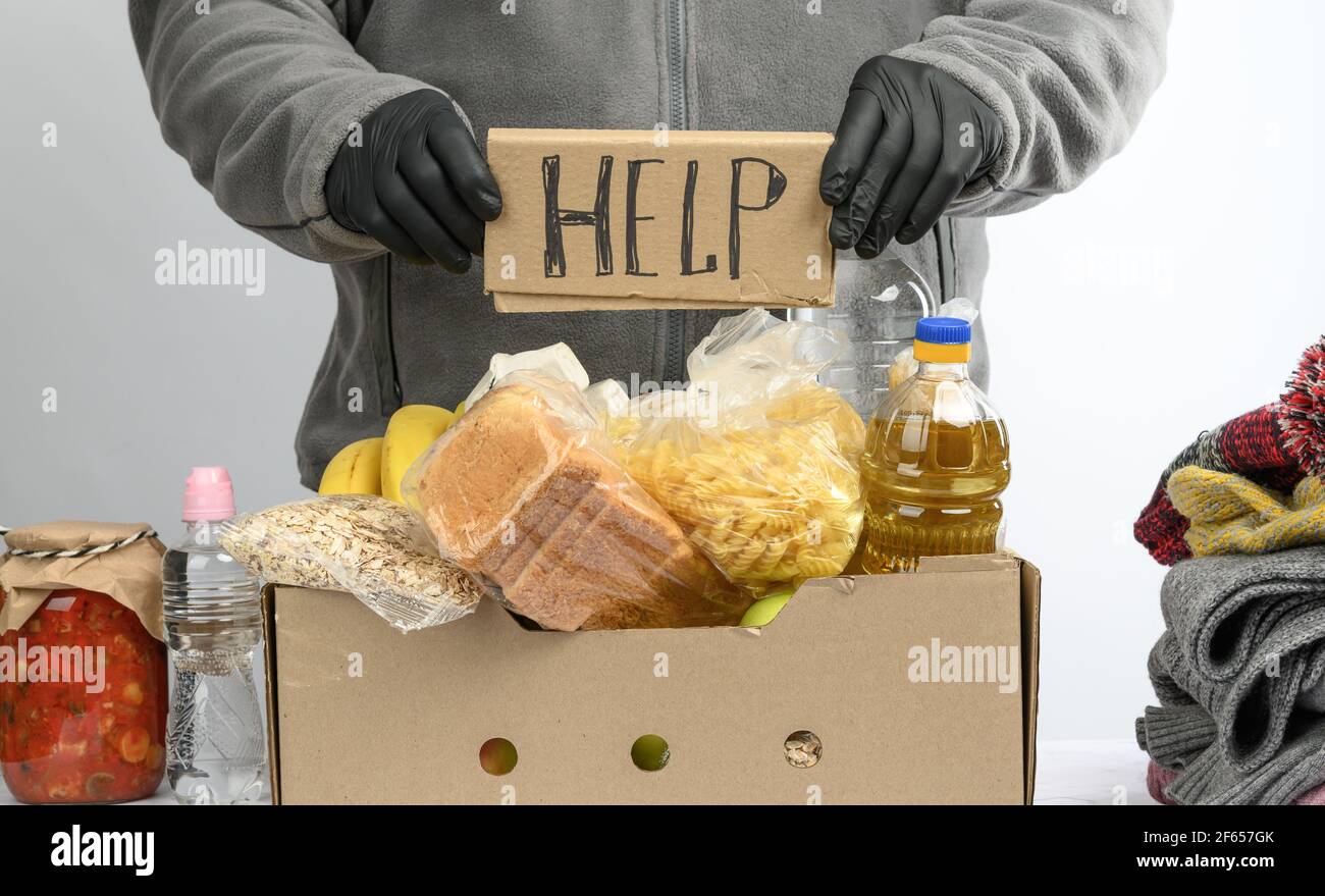 collects food, fruits and things in a cardboard box to help the needy ...