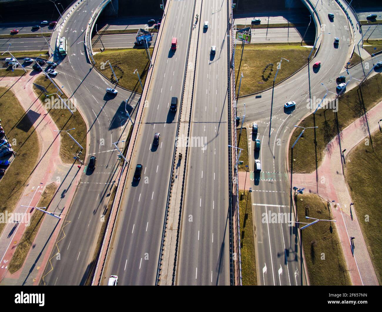 Aerial view at junctions of city highway. Vehicles drive on roads ...