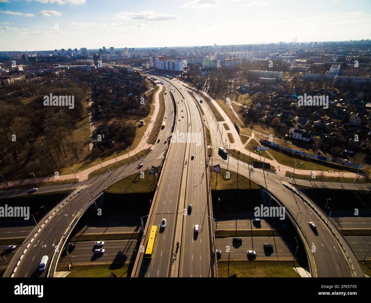 Aerial view at junctions of city highway. Vehicles drive on roads ...
