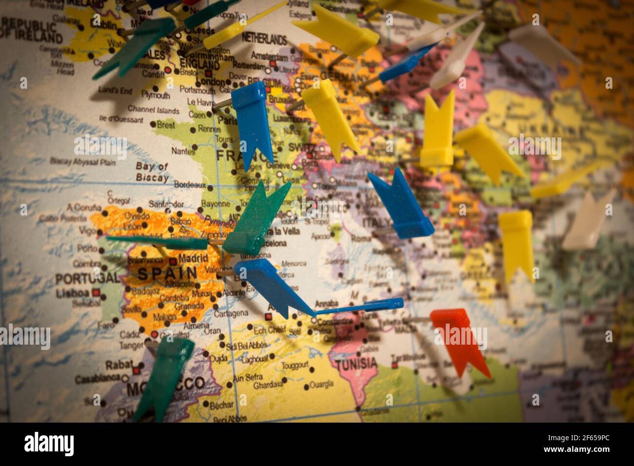 Beautiful close up of multicolored pin flags attached to a world map ...