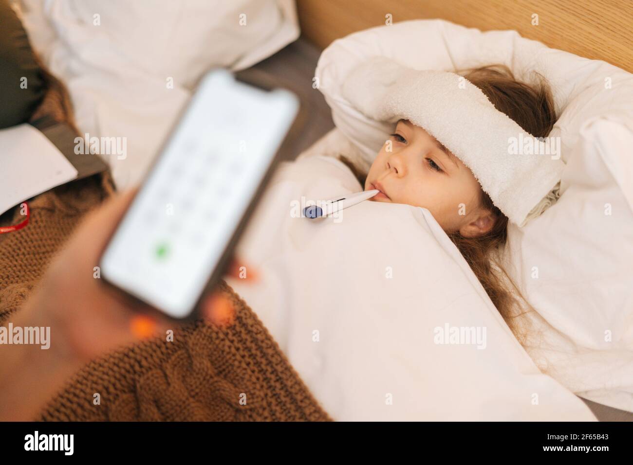 Worried Parent Sick Child High Resolution Stock Photography and Images ...