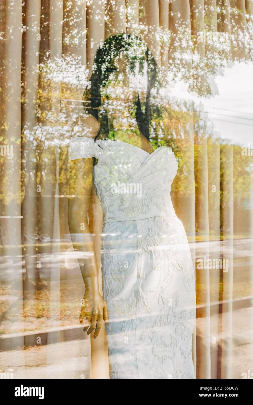mannequin in window display. Showcase mannequin wedding dress. Wedding ...