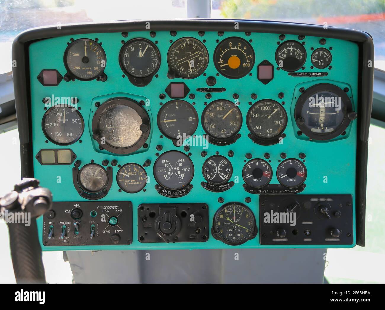 The cockpit of a Russian helicopter with control devices (the names of ...
