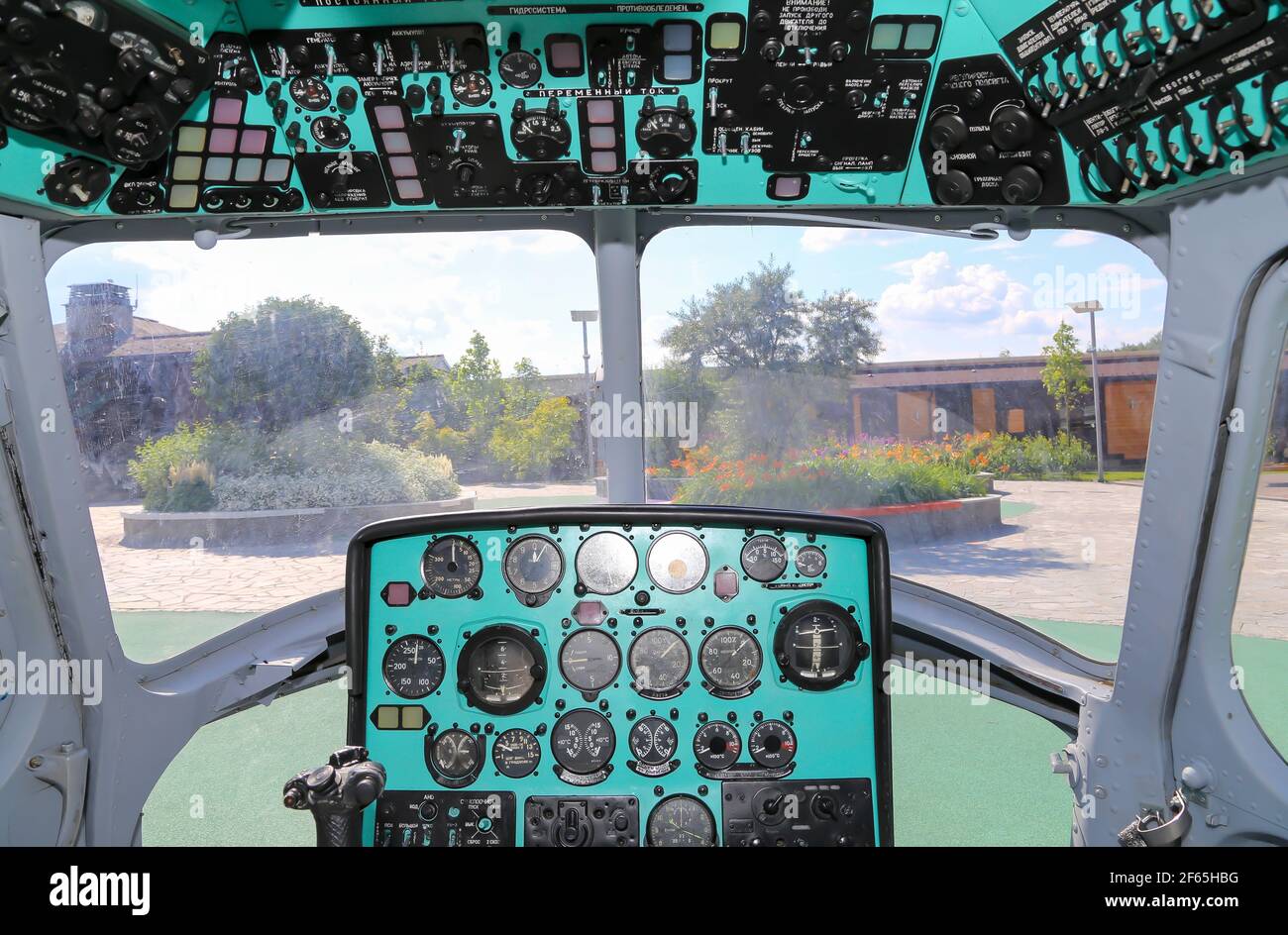 The cockpit of a Russian helicopter with control devices (the names of ...