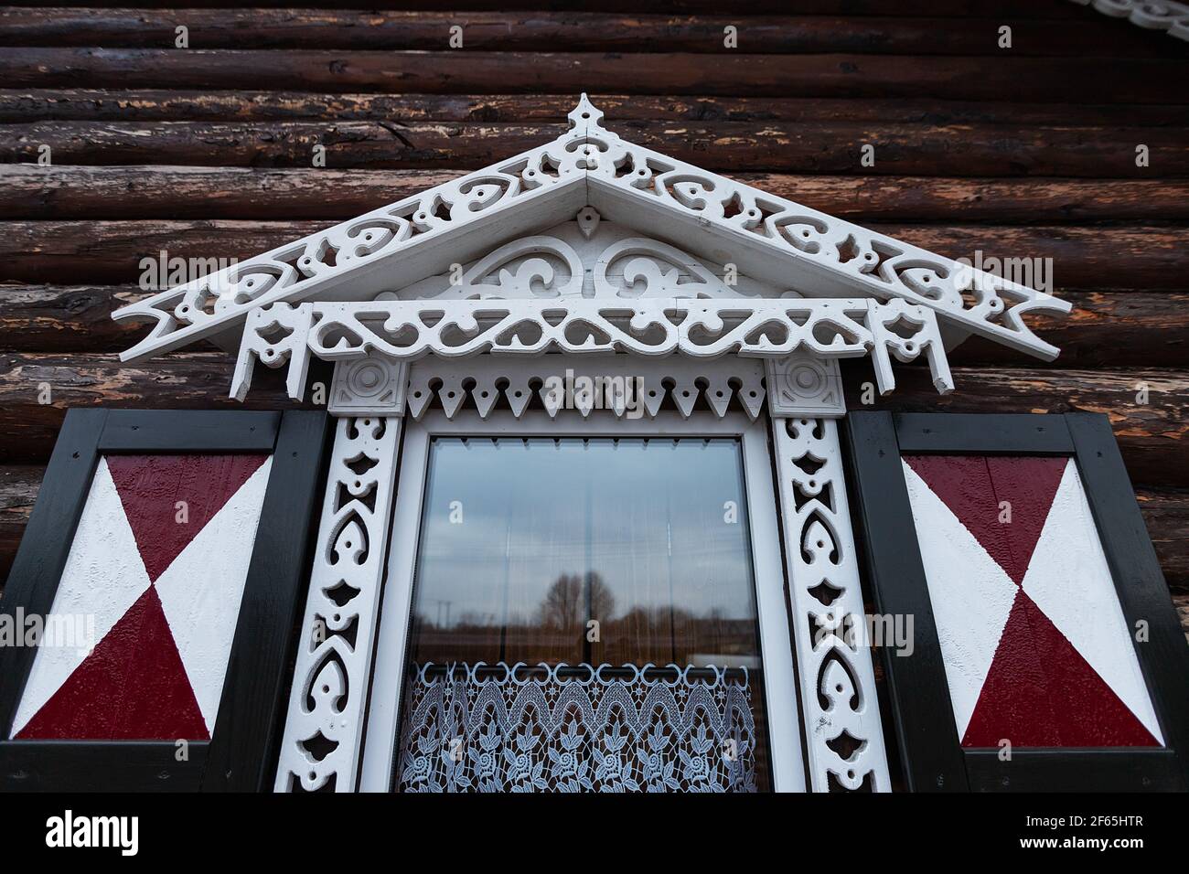 carved platbands on the windows. decorative decoration with wooden ...