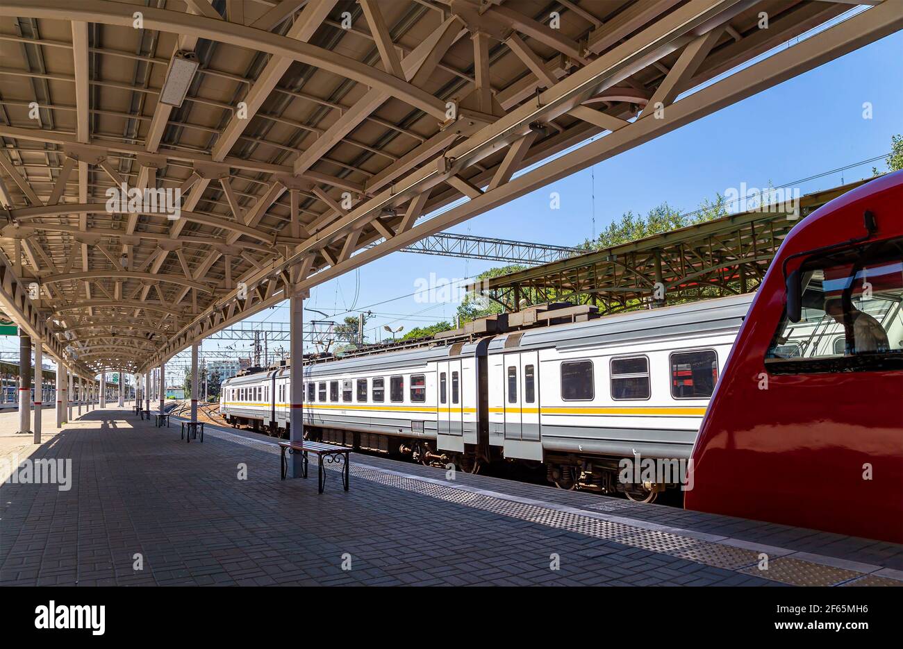 Train on Moscow passenger platform (Belorussky railway station) is one ...