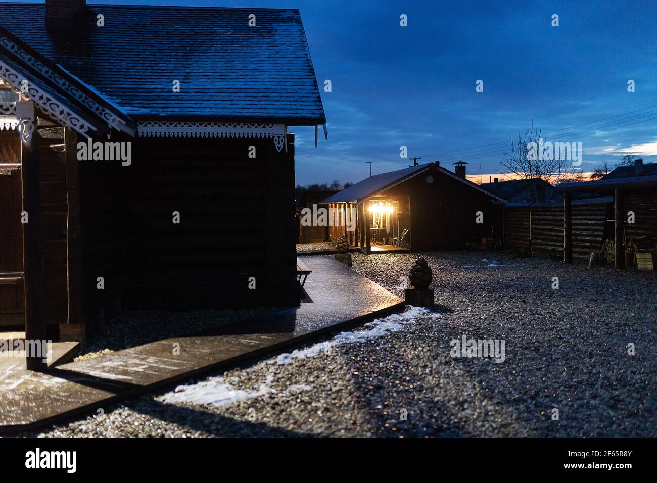 beautiful wooden hut. night illumination from lanterns illuminates the ...