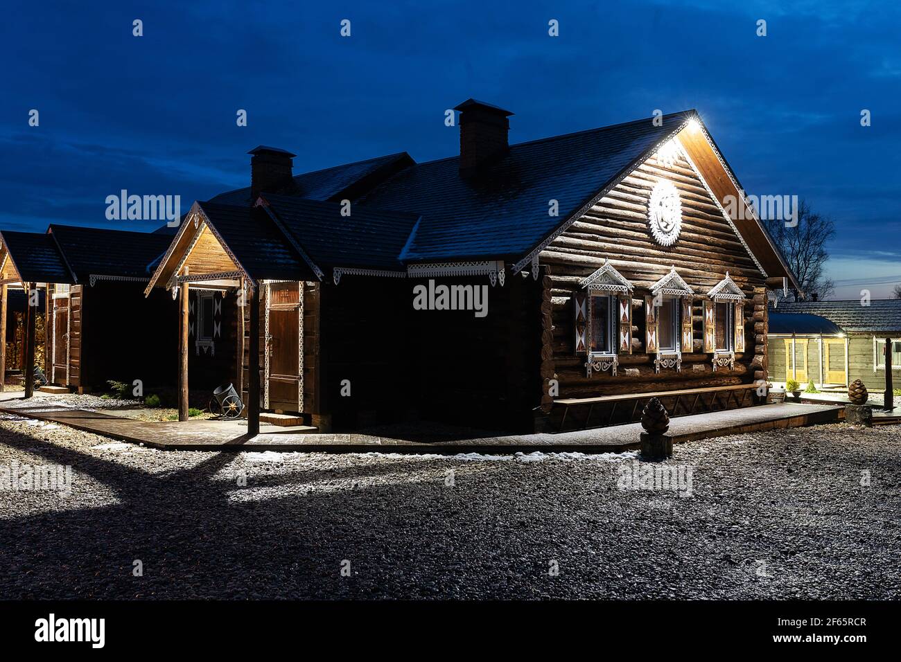 beautiful wooden hut. night illumination from lanterns illuminates the ...