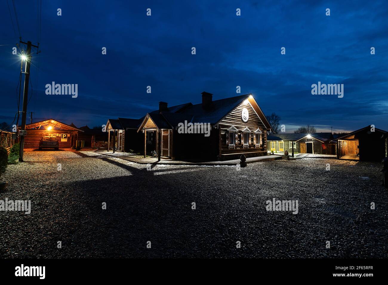 beautiful wooden hut. night illumination from lanterns illuminates the ...