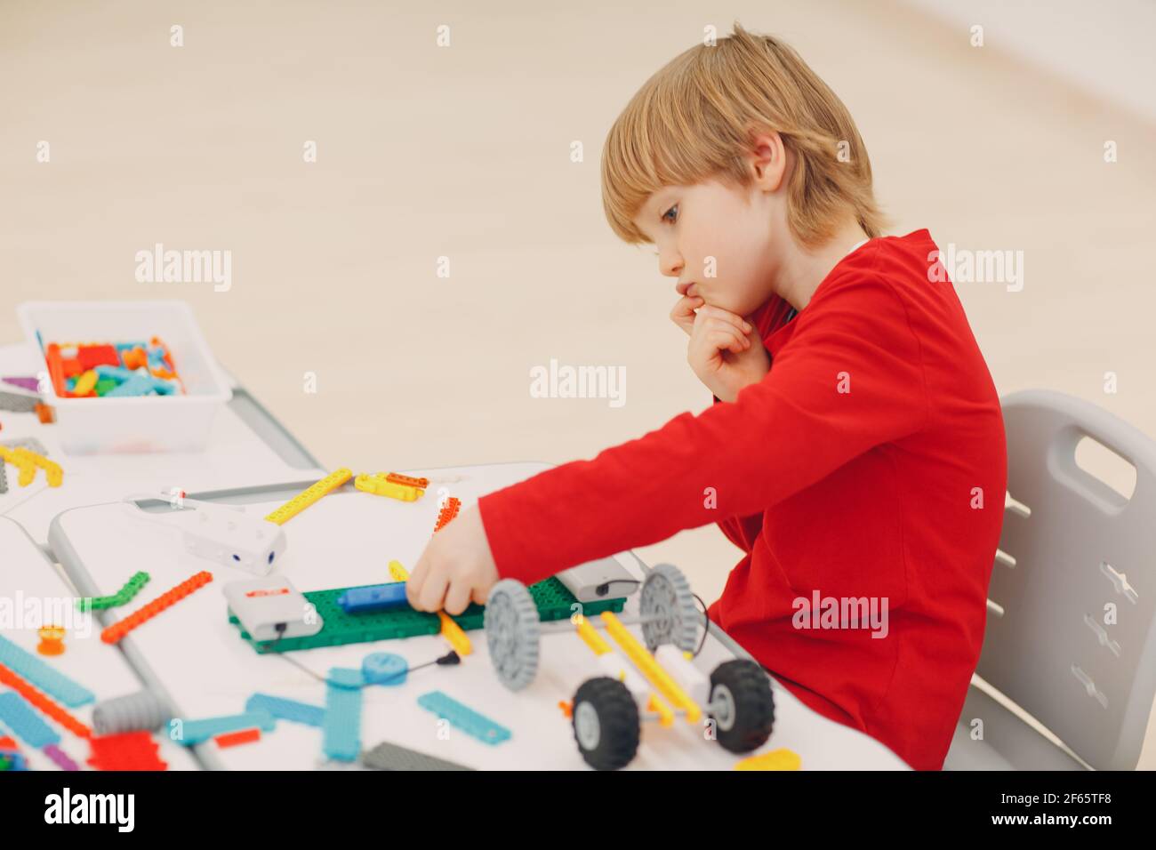 Little boy kid child constructor checking technical toy. Children ...