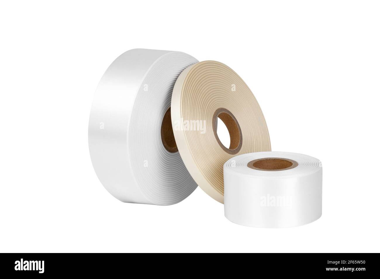 composition of three coils of white, beige satin ribbons of different ...