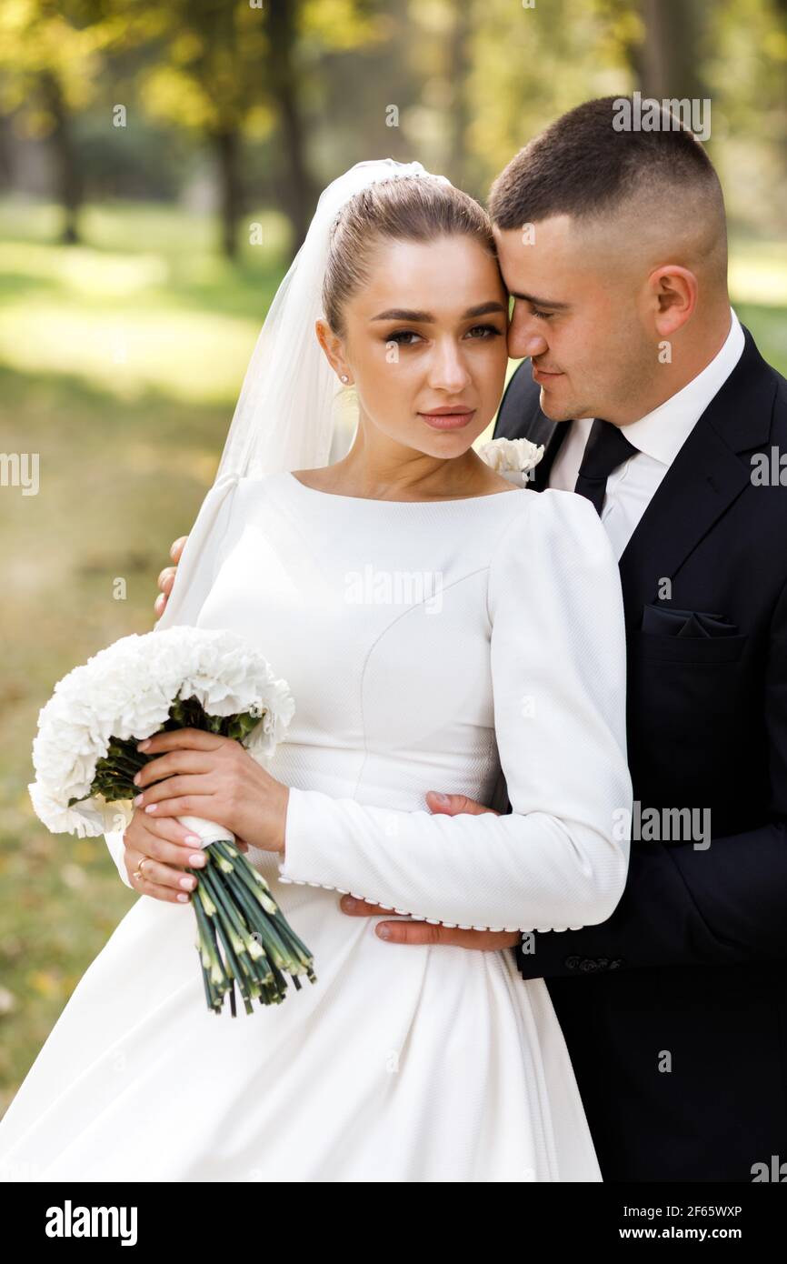 Bride walking groom in park hi-res stock photography and images - Alamy