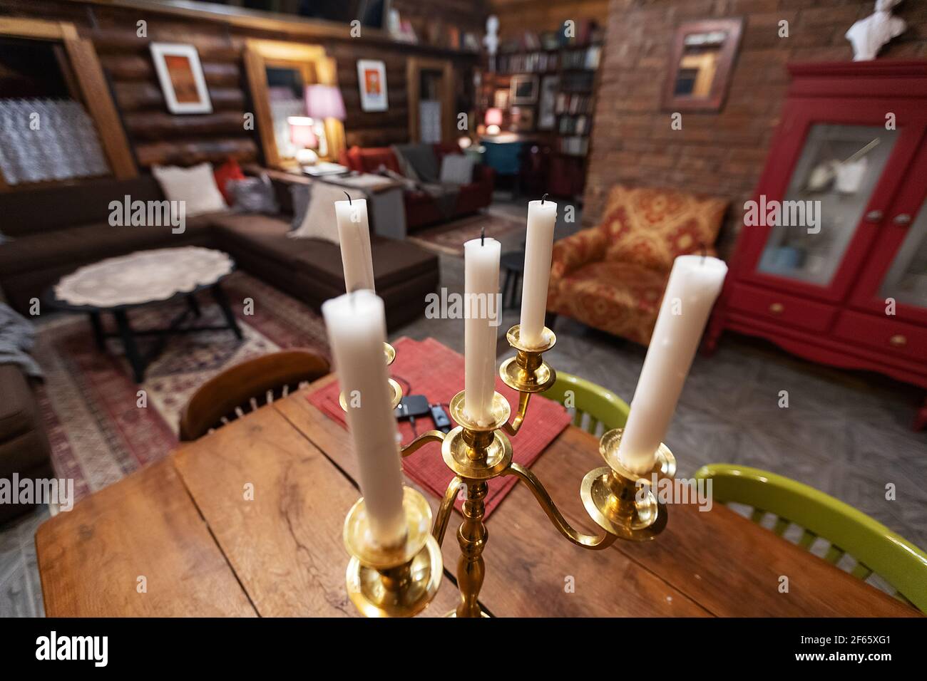 the candle holder is on the table. wax candles for old-fashioned room ...