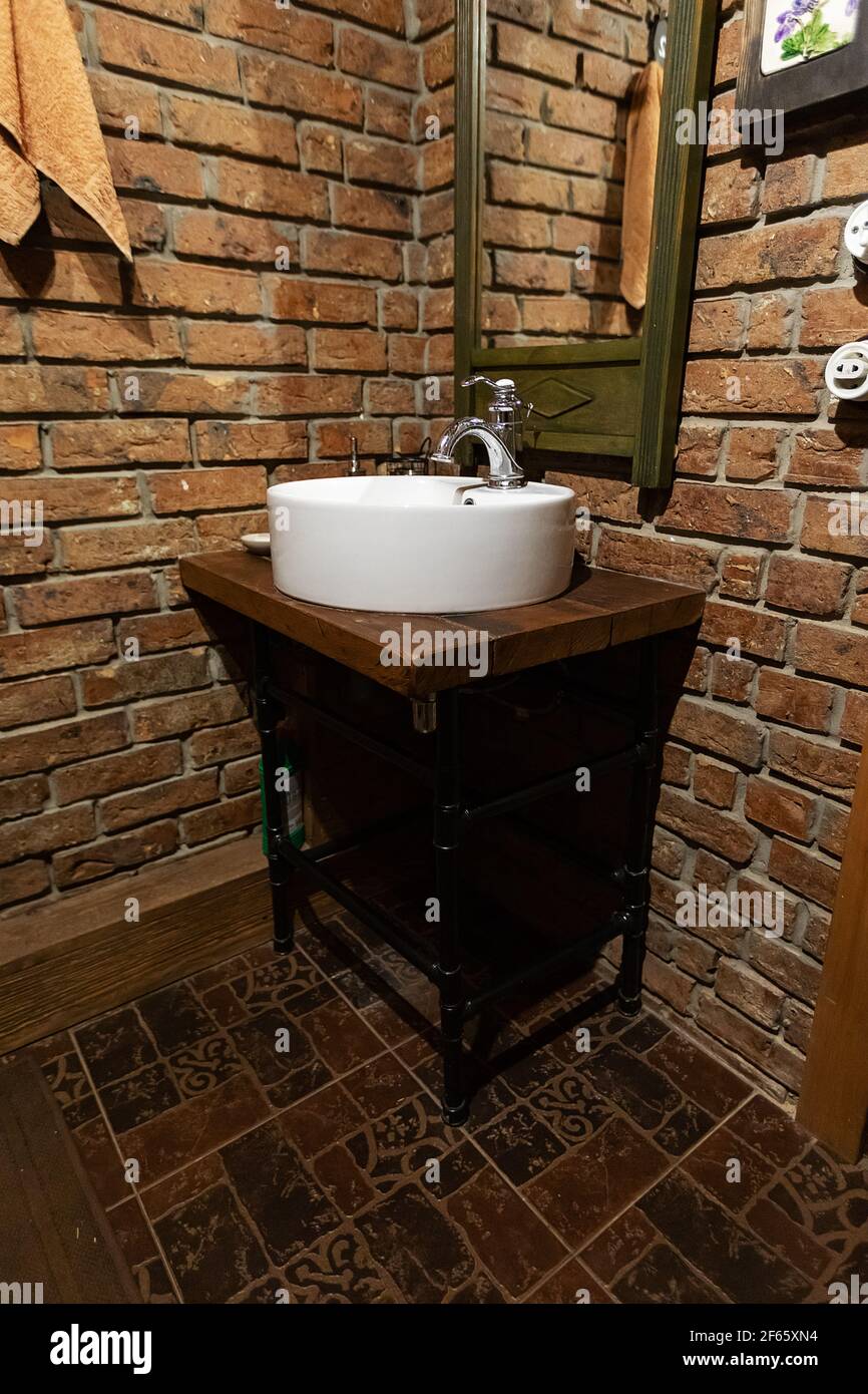 white washbasin in the bathroom. new minimalistic interior in the ...