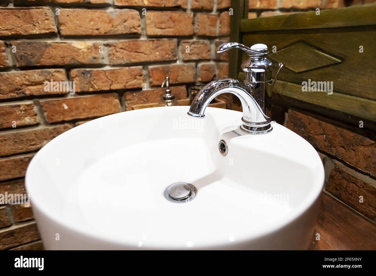white washbasin in the bathroom. new minimalistic interior in the ...