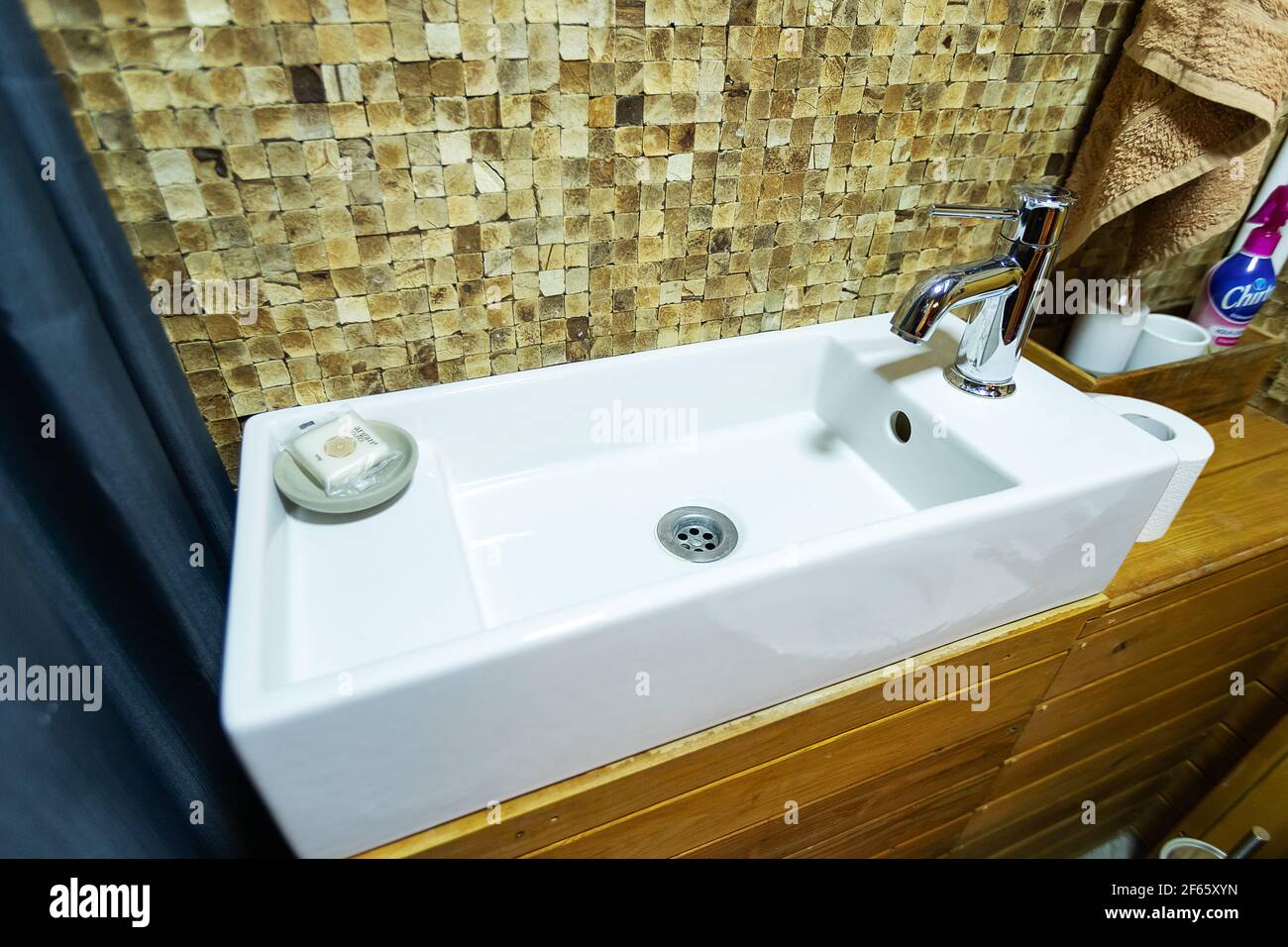 white washbasin in the bathroom. new minimalistic interior in the ...