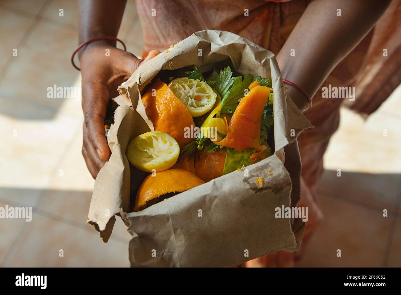 Collecting kitchen waste for composting Stock Photo - Alamy