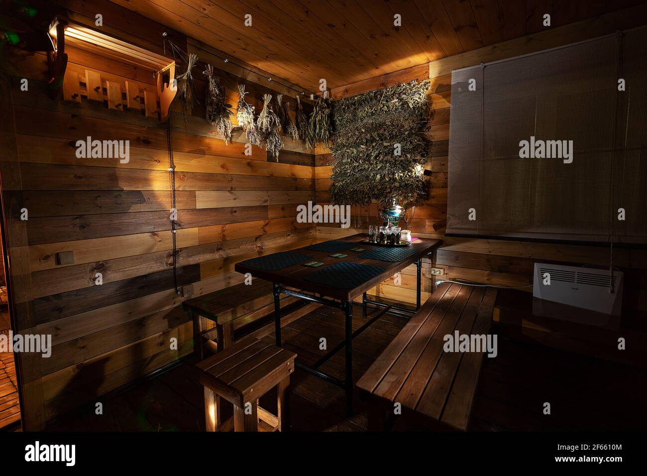 wooden table and chairs in the sauna. dressing room and steam room for ...