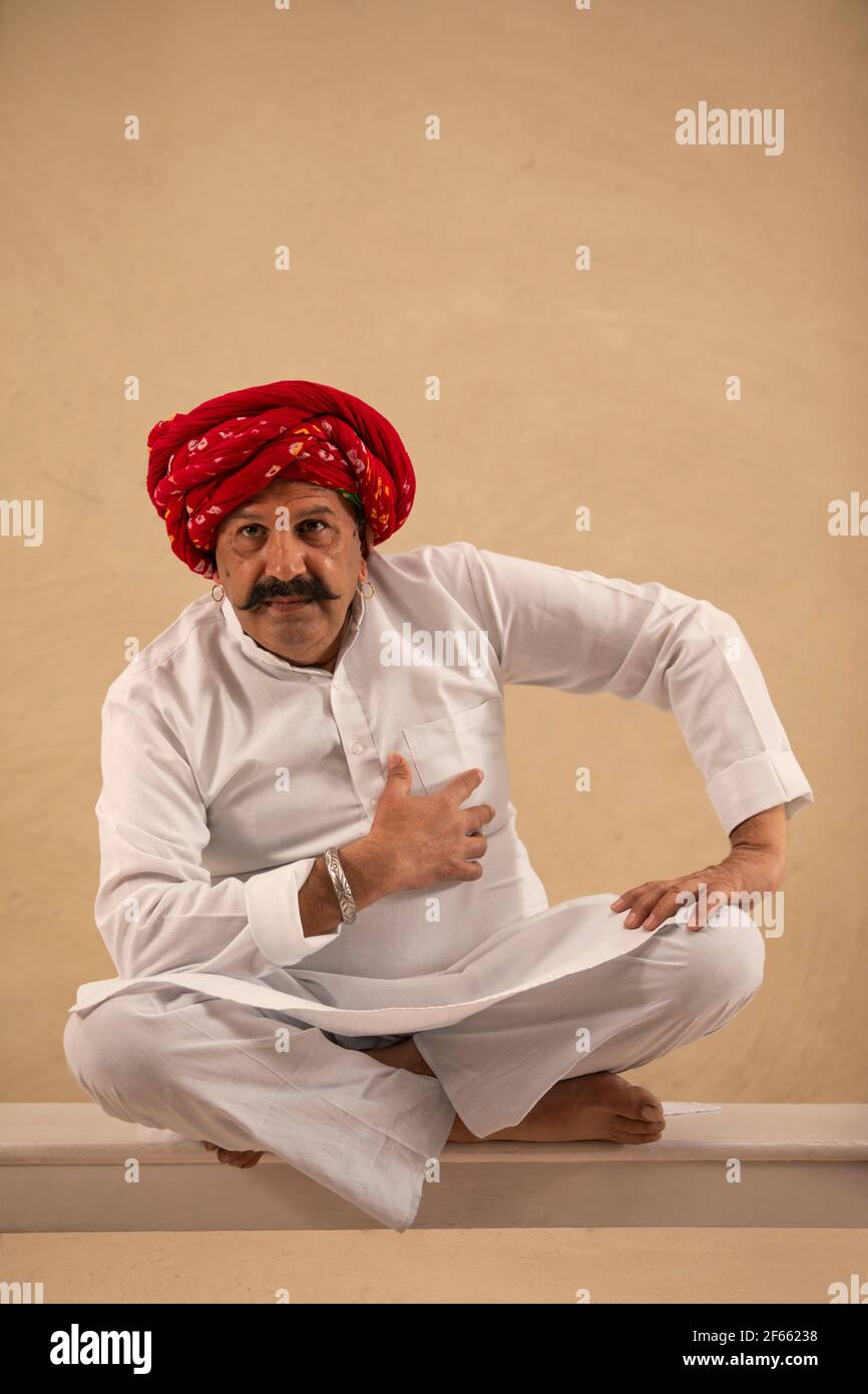 A TURBANED VILLAGER SITTING ALONE AND LOOKING AWAY Stock Photo - Alamy