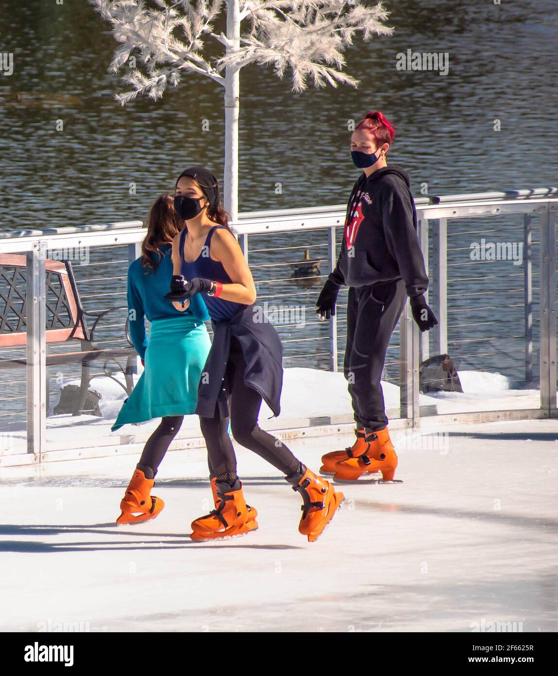 Orlando, Florida. December 22, 2020. People skating on ice rink at ...