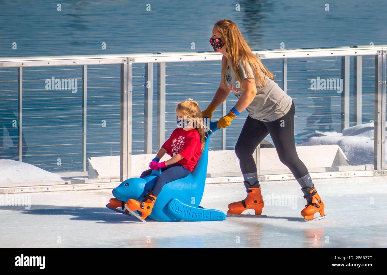 Orlando, Florida. December 22, 2020. People skating on ice rink at ...