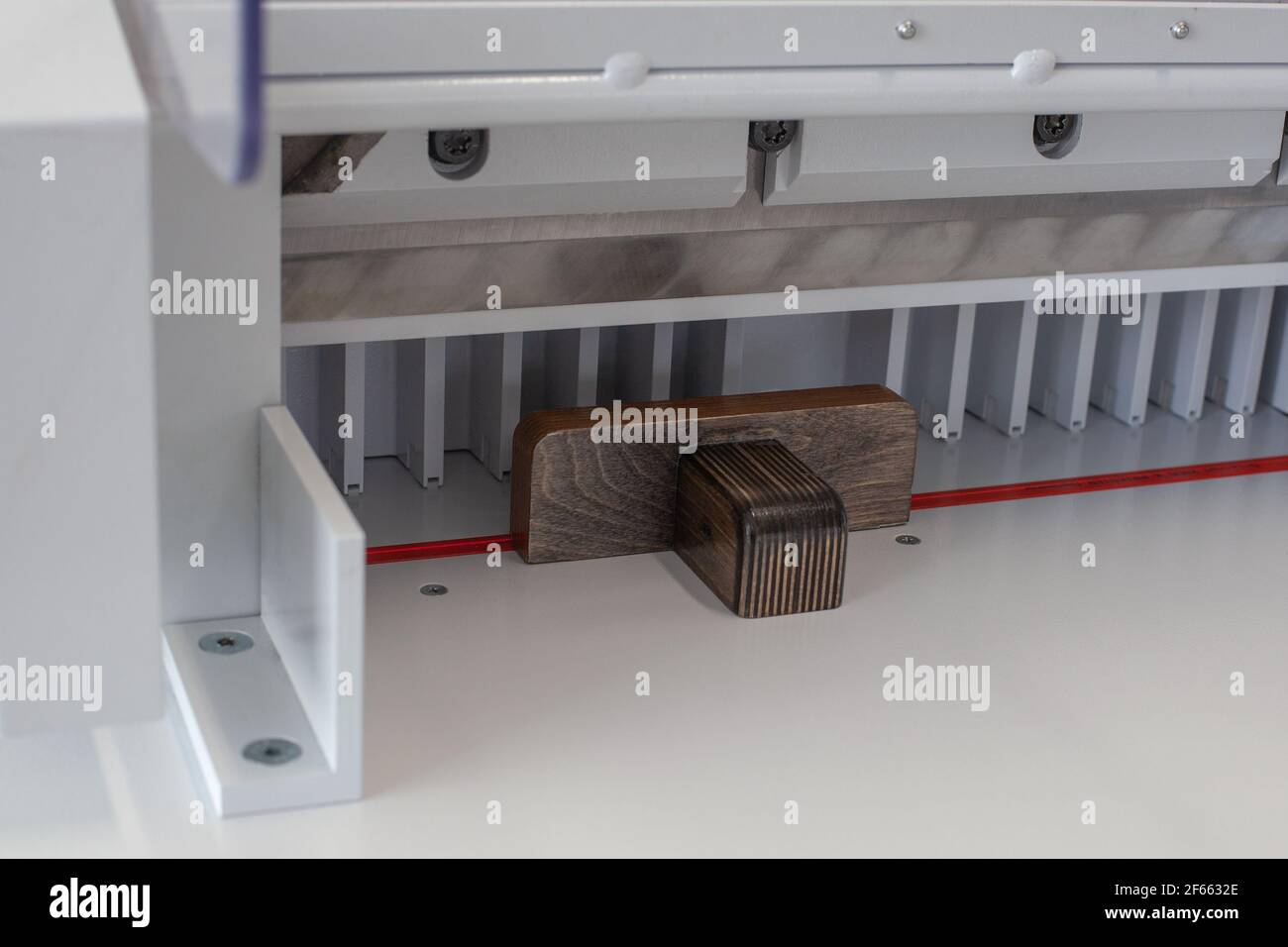 wooden pusher on automatic paper stack or label cutting machine ...
