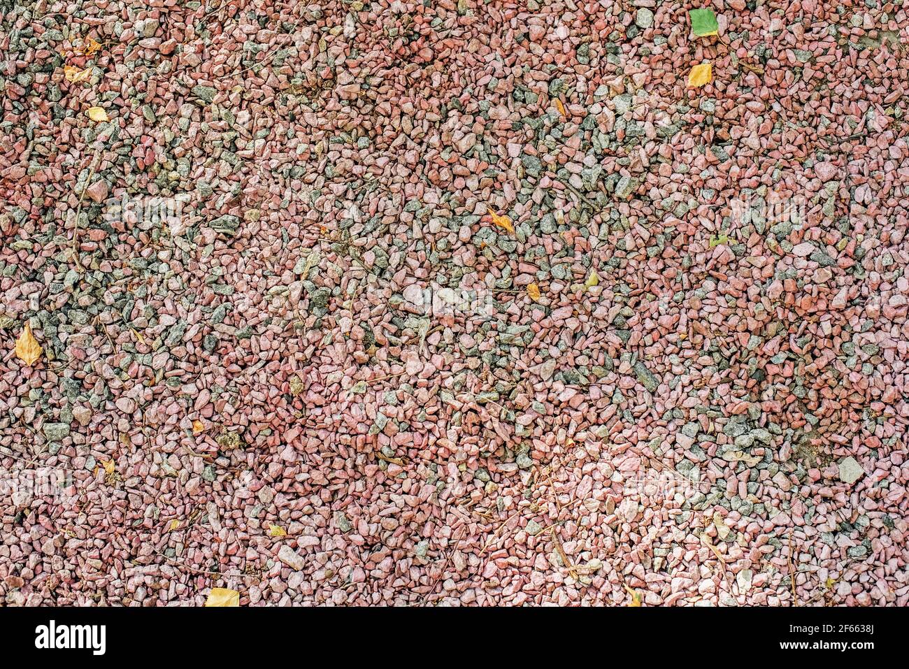 Lots of colorful small stones close up. Pink crushed stone macro photo ...