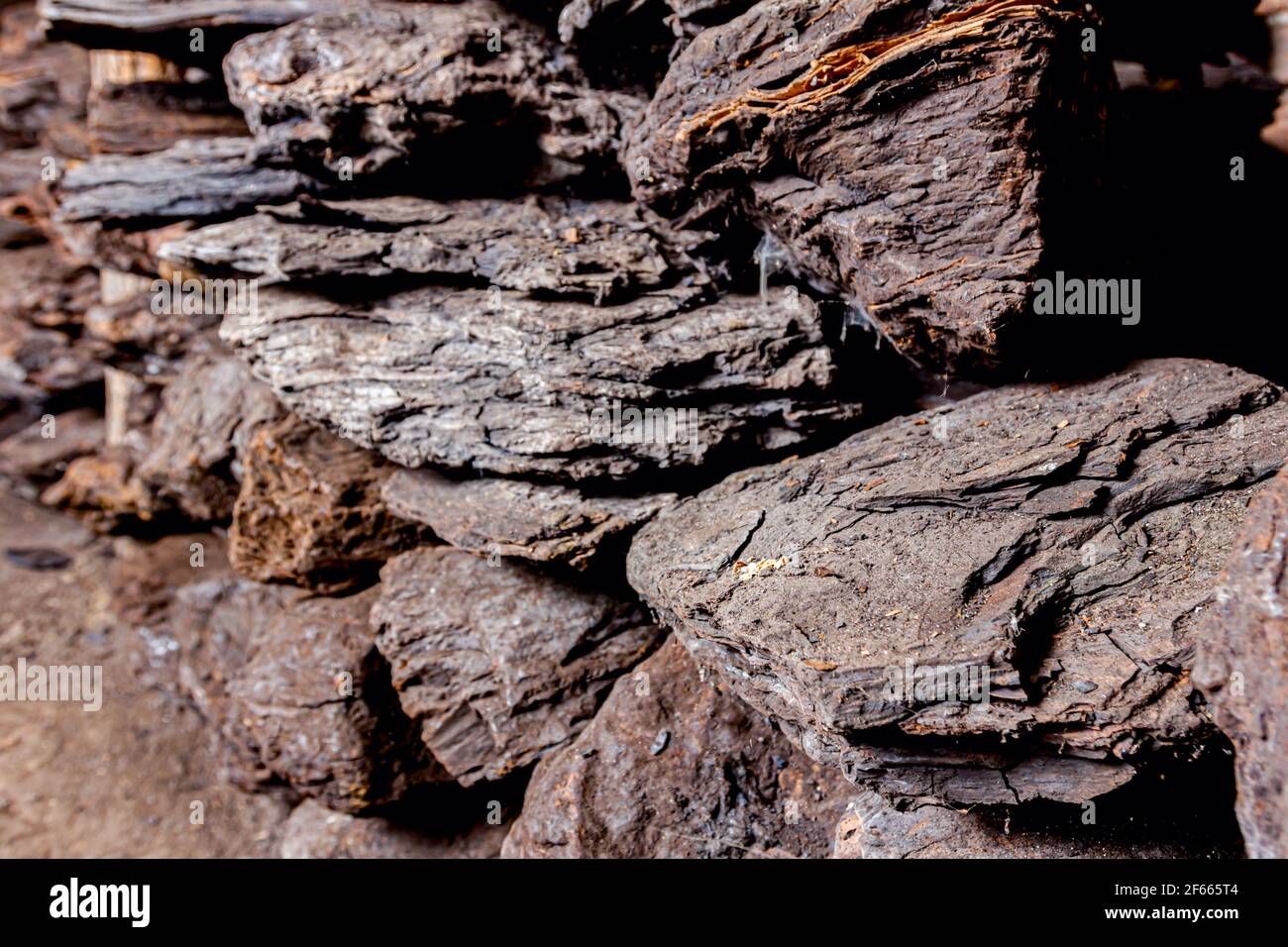 Storage of dry wooden coal, charcoal is piled and ready for ussage ...