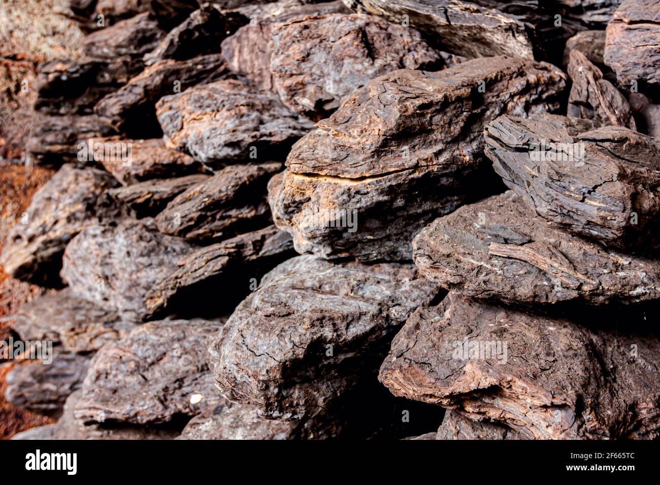 Storage of dry wooden coal, charcoal is piled and ready for ussage ...