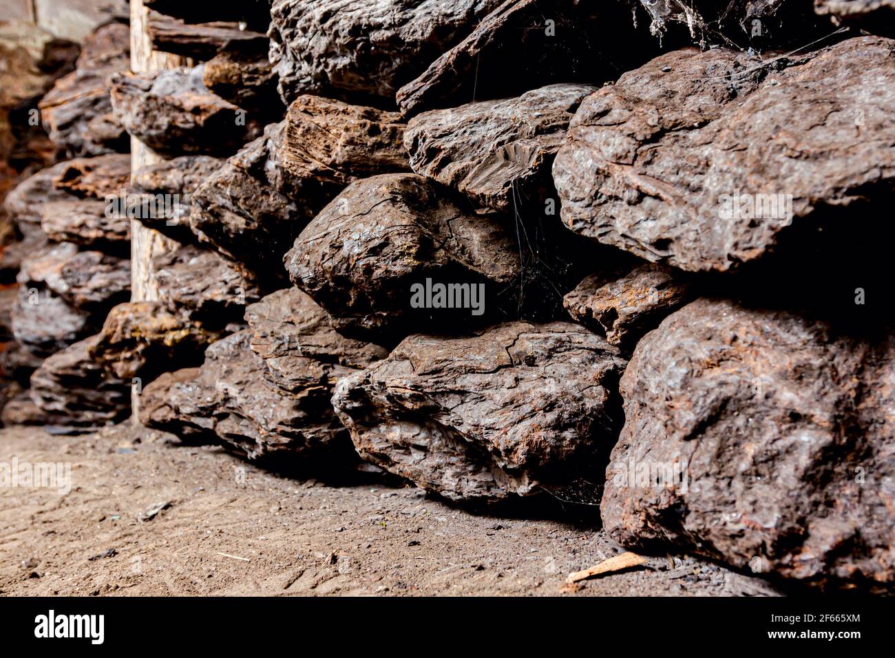 Storage of dry wooden coal, charcoal is piled and ready for ussage ...