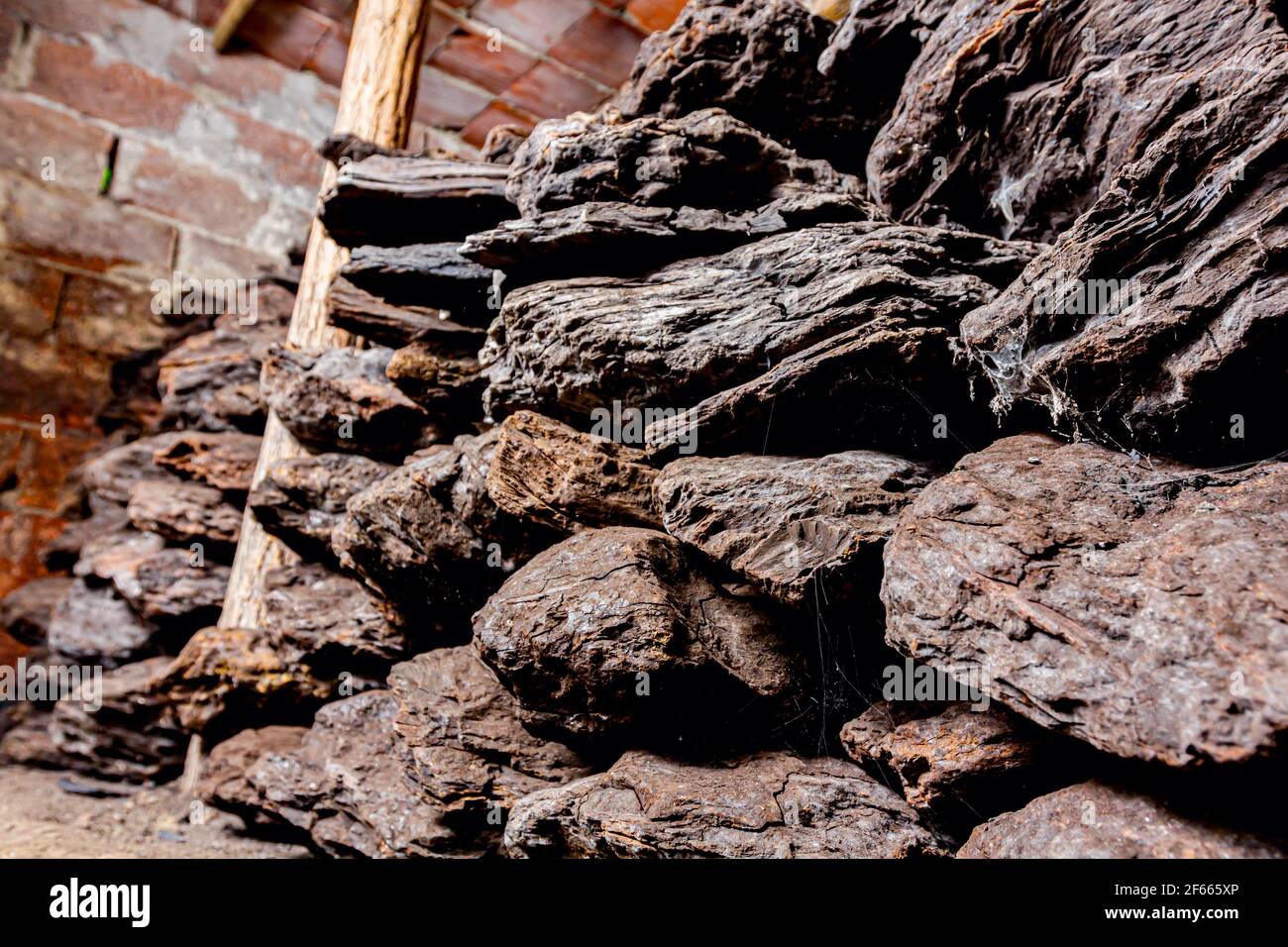 Storage of dry wooden coal, charcoal is piled and ready for ussage ...