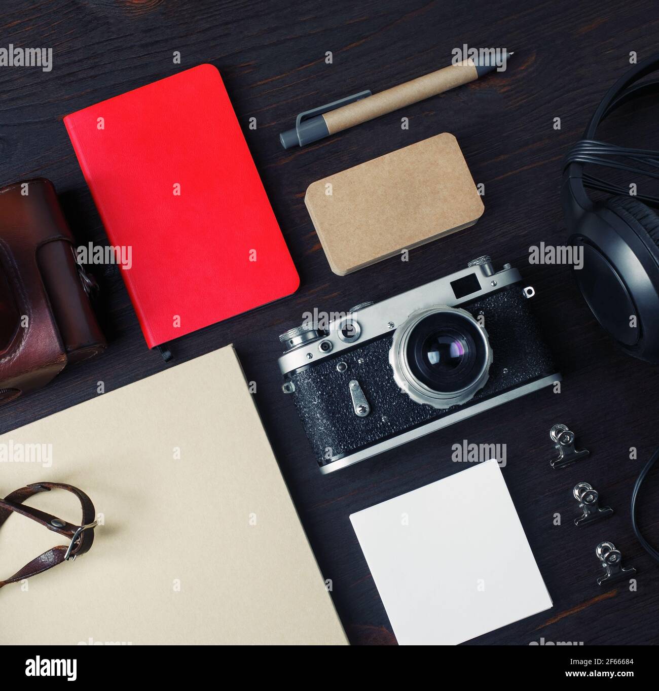 Personal traveler's items. Old photo camera and vintage stationery. Top ...