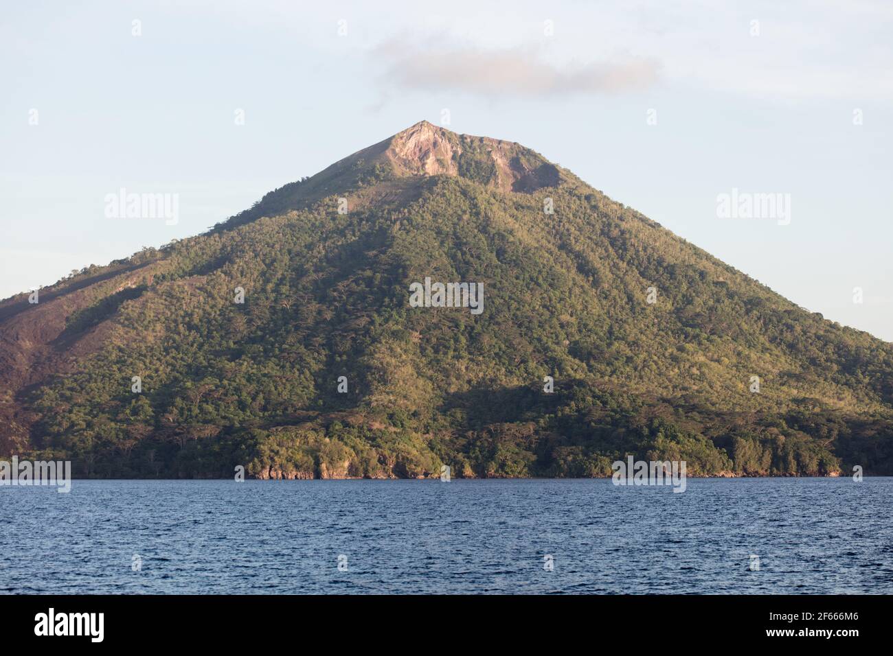 Banda Api, an active volcano in the Banda Islands of Indonesia, rises ...