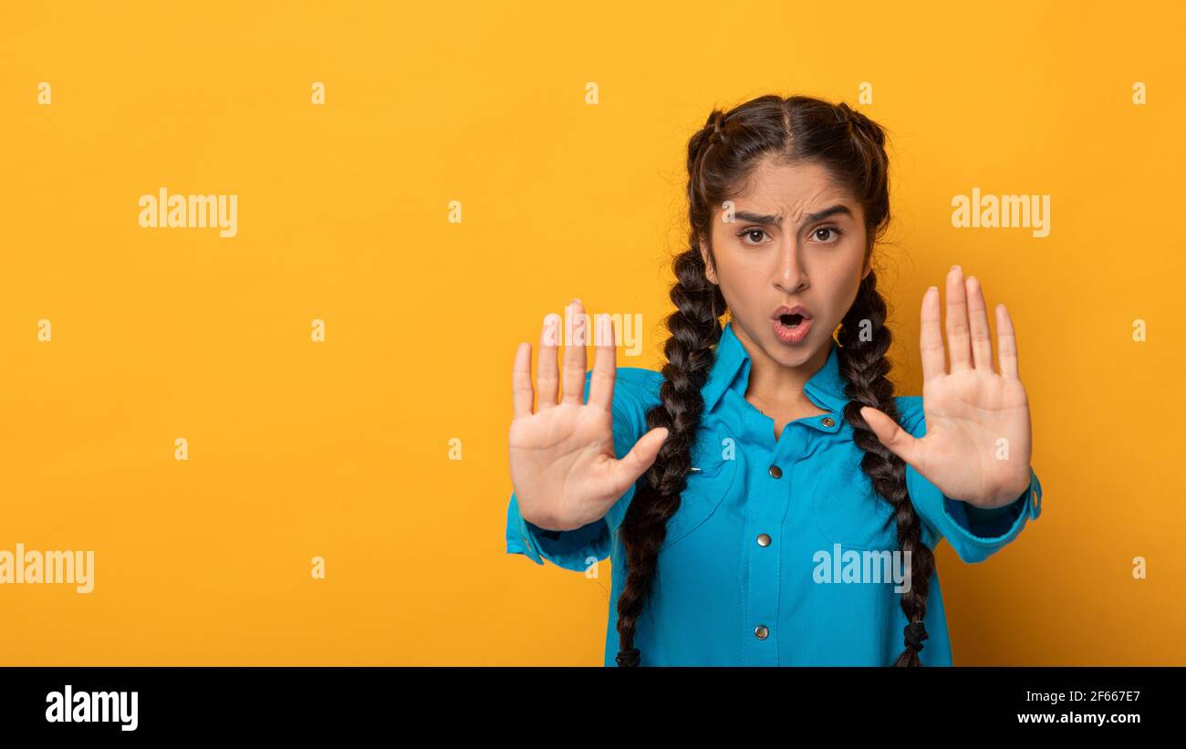 Portrait of a serious indian woman showing stop sign gesture Stock ...