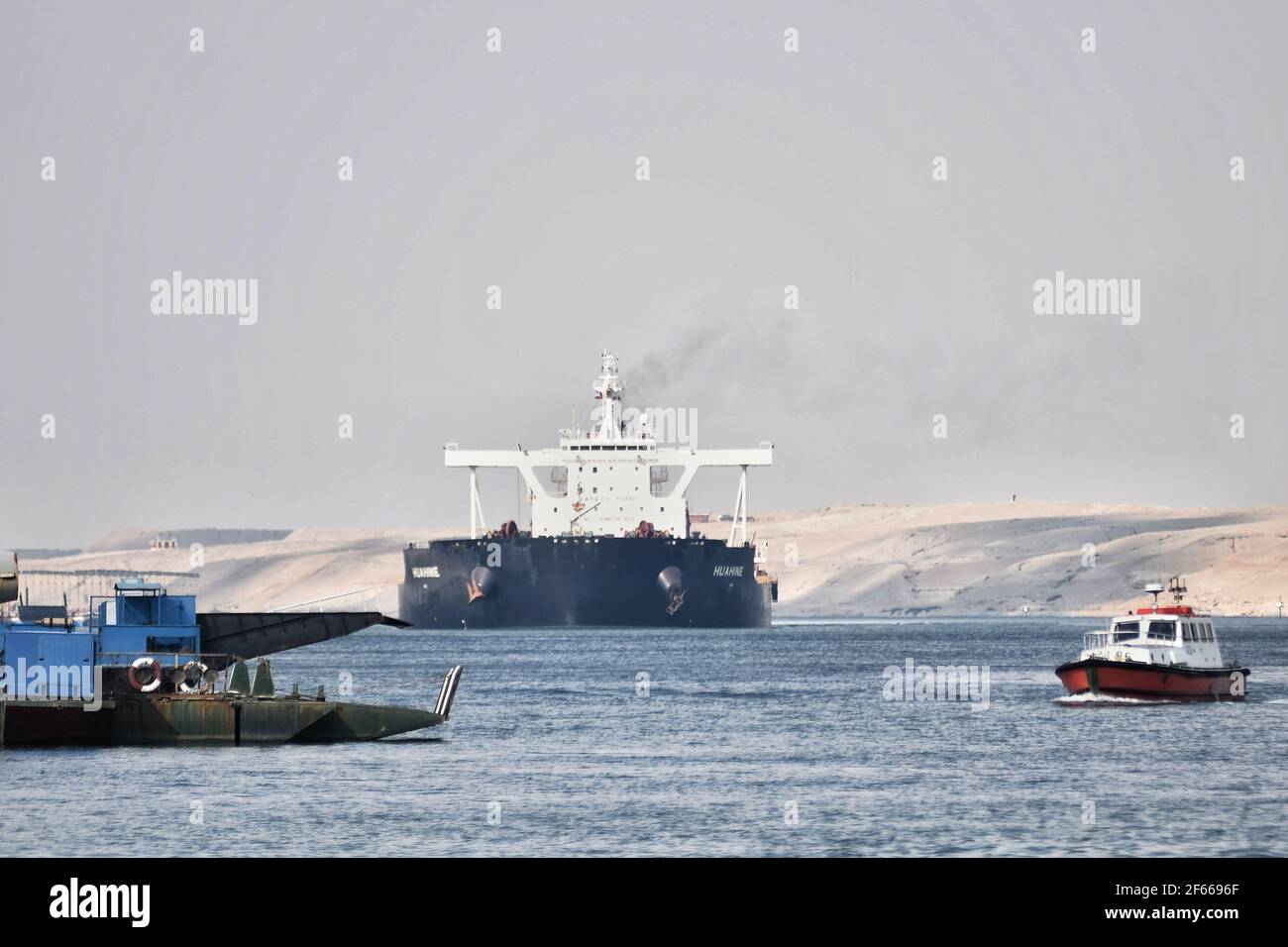 Ismailia, Egypt. 30th Mar, 2021. A ship sails through the Suez Canal as ...