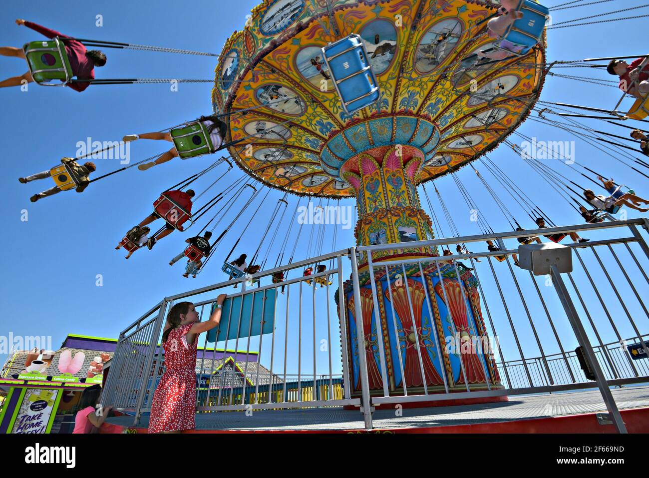 Landscape With People Riding The Sea Swings A Fun Ride At The Santa Cruz Amusement Park In