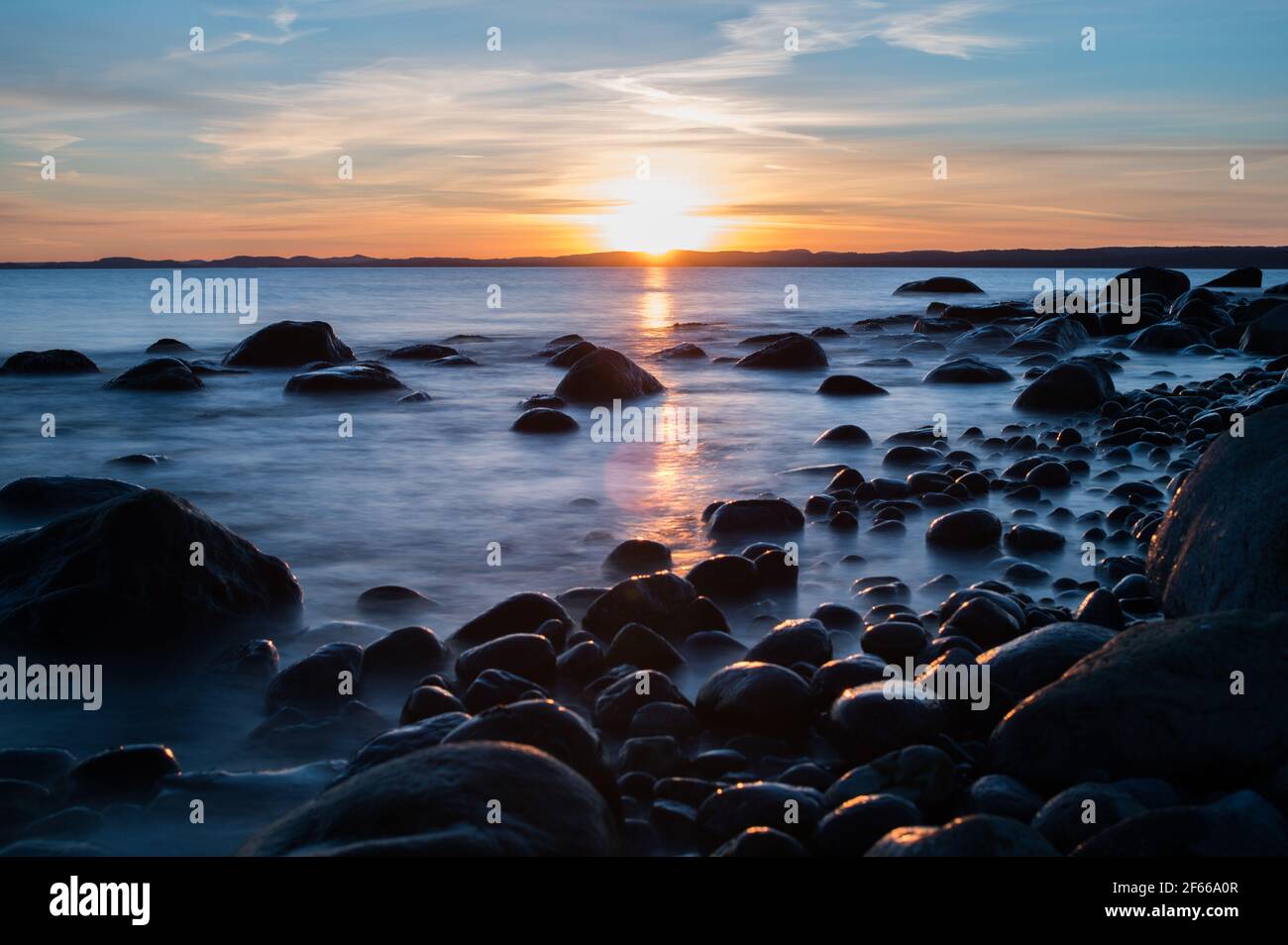 Just before sunset at Mølen beach Stock Photo - Alamy