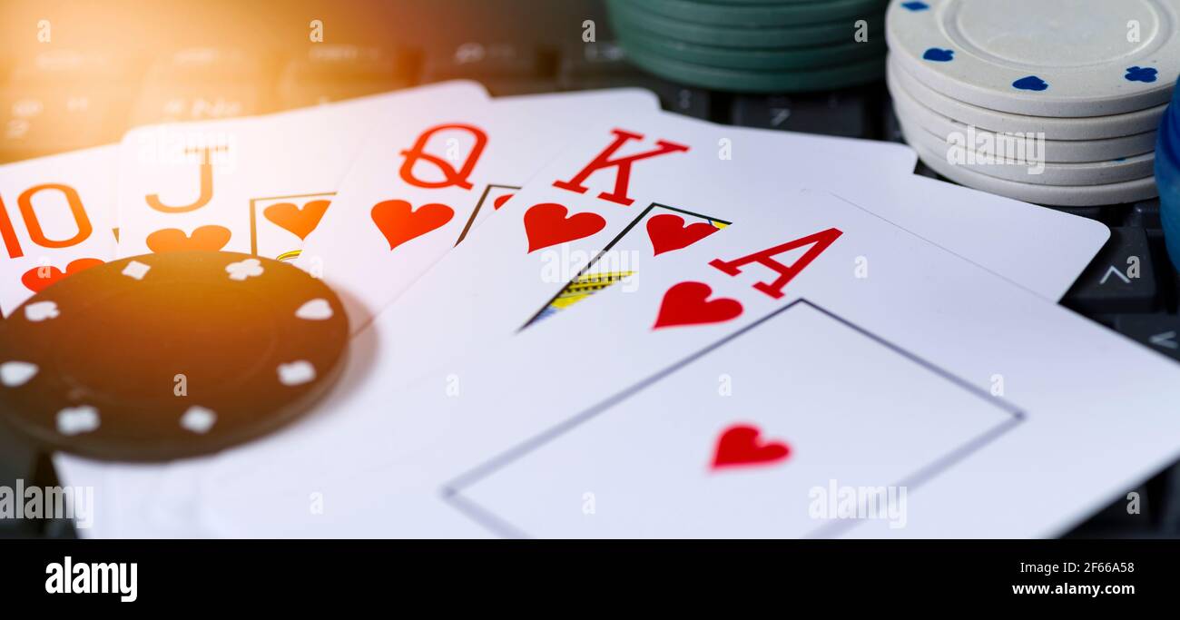 Game cards of the same suit against the background of casino chips ...