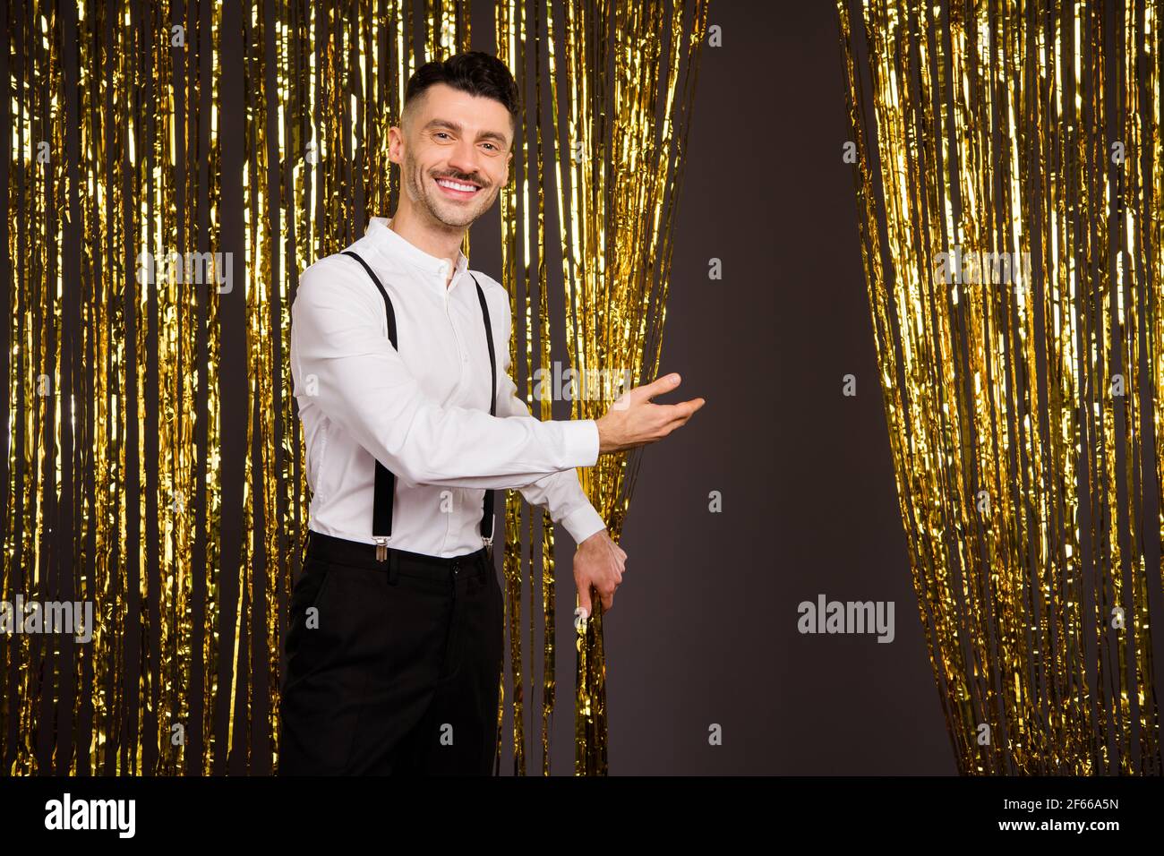 Photo of young handsome man happy positive smile show hand welcome ...