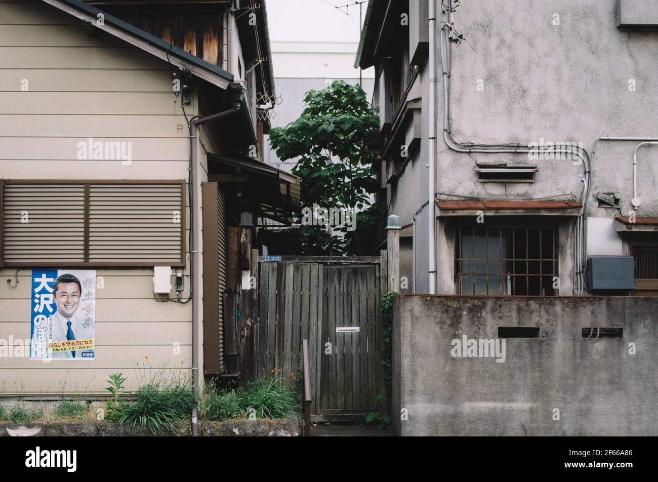 Tokyo, Japan - Old house with a politician poster on its wall. Scene of ...