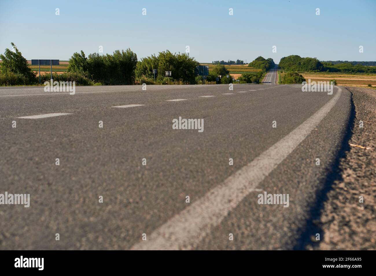 soft focus asphalt road surface with white markings close-up from the ...