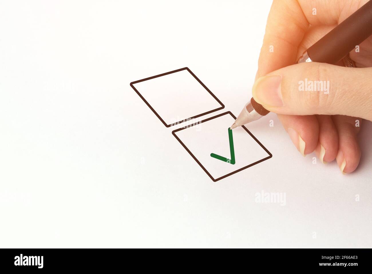 Male Hand Drawing Tick in Check Box. Cropped image of hand writing on ...