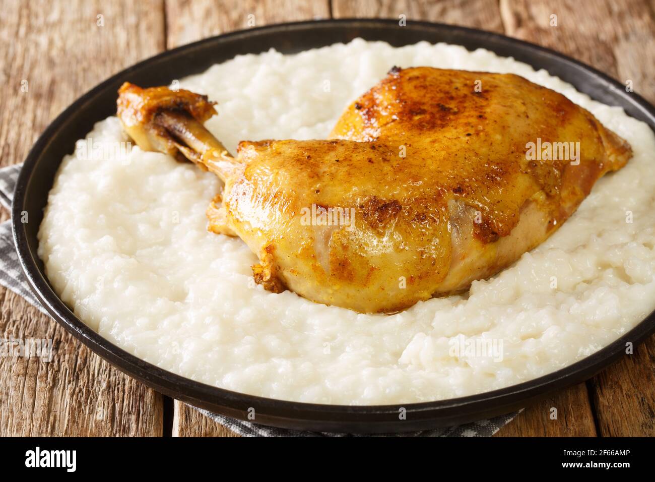 Traditional Arabian dish Saleeg of creamy white rice served with ...