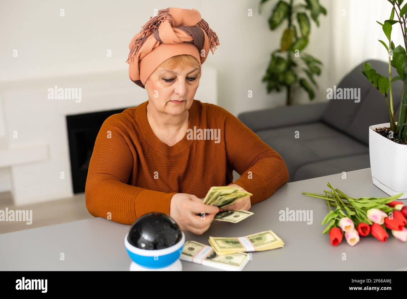 Female psychic or fortune teller gesturing with her hands indicating ...