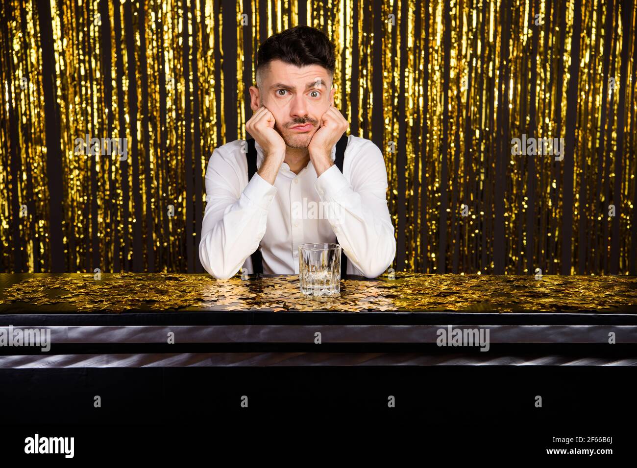 Photo of young man unhappy sad upset hands touch cheeks bored party ...