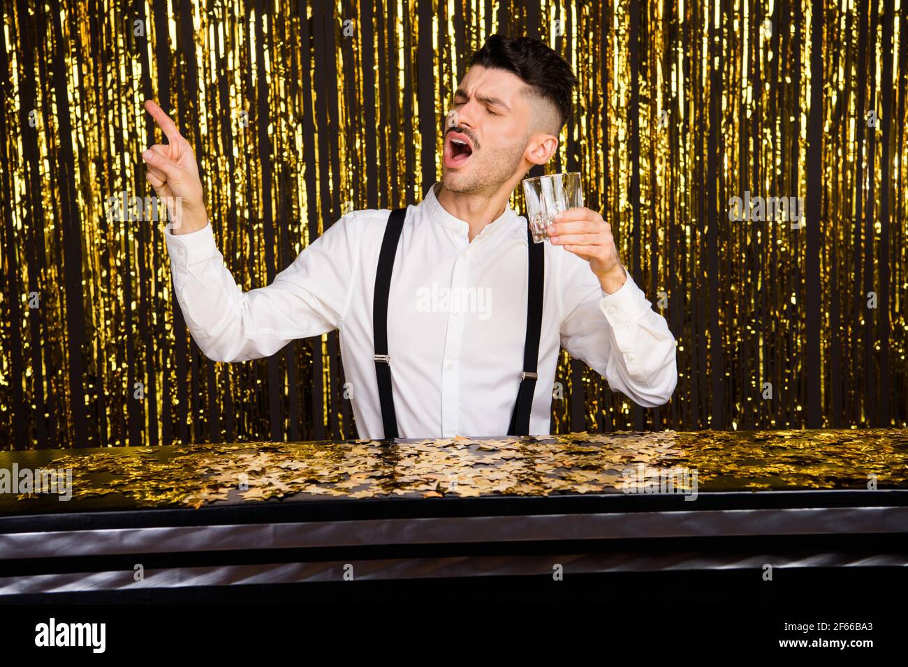 Photo of young handsome man excited crazy have fun enjoy party drink ...