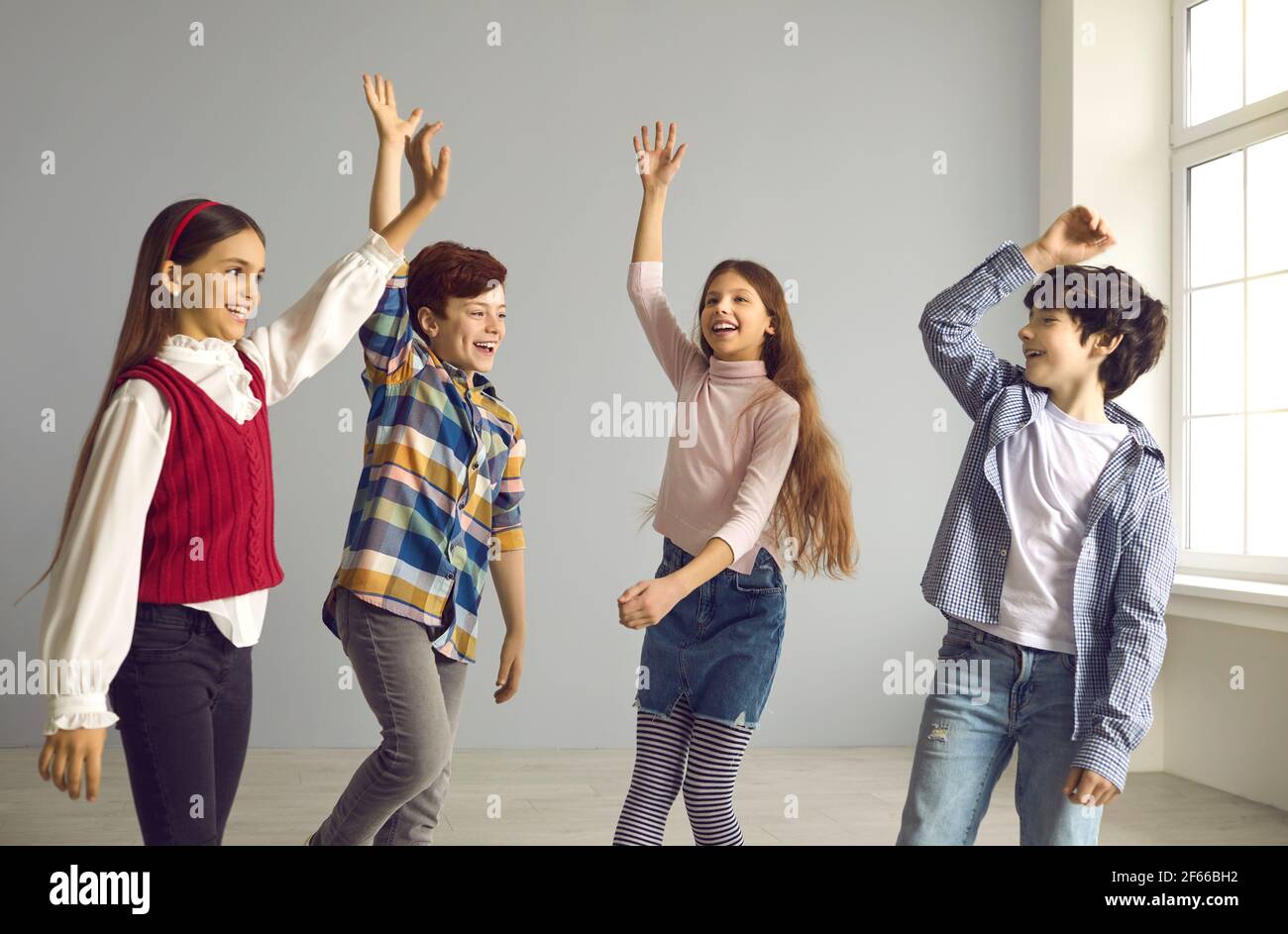Bunch of cheerful kids dancing, laughing, having fun and enjoying their ...