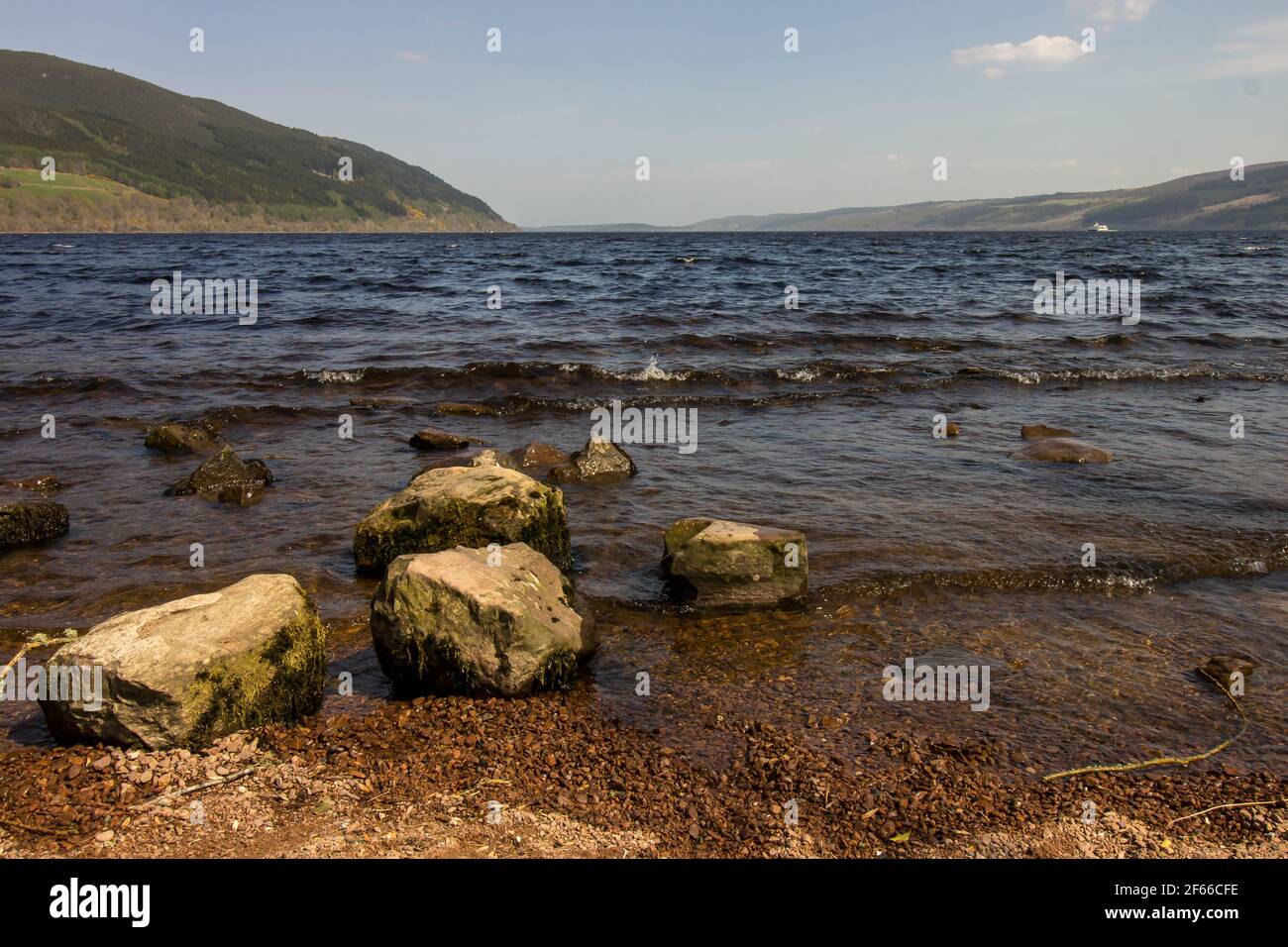 Large Boulders at the water’s edge of Loch Ness Scotland, on a clear ...